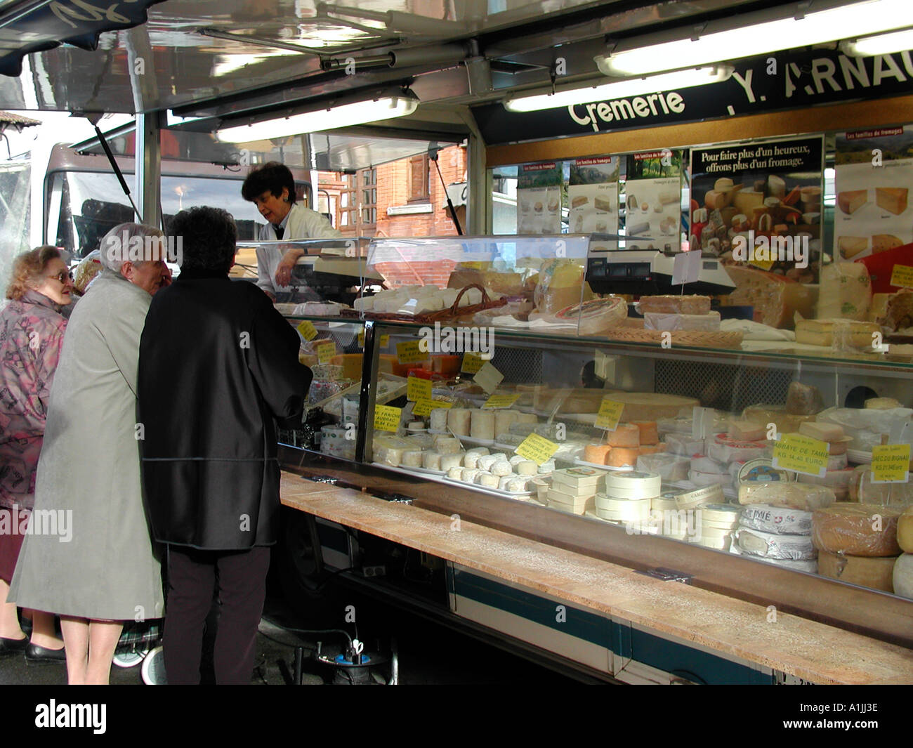 Cheese stall in market in Rieumes France Stock Photo - Alamy