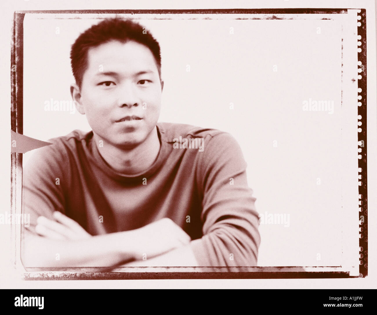 Portrait of a young man grinning Stock Photo - Alamy