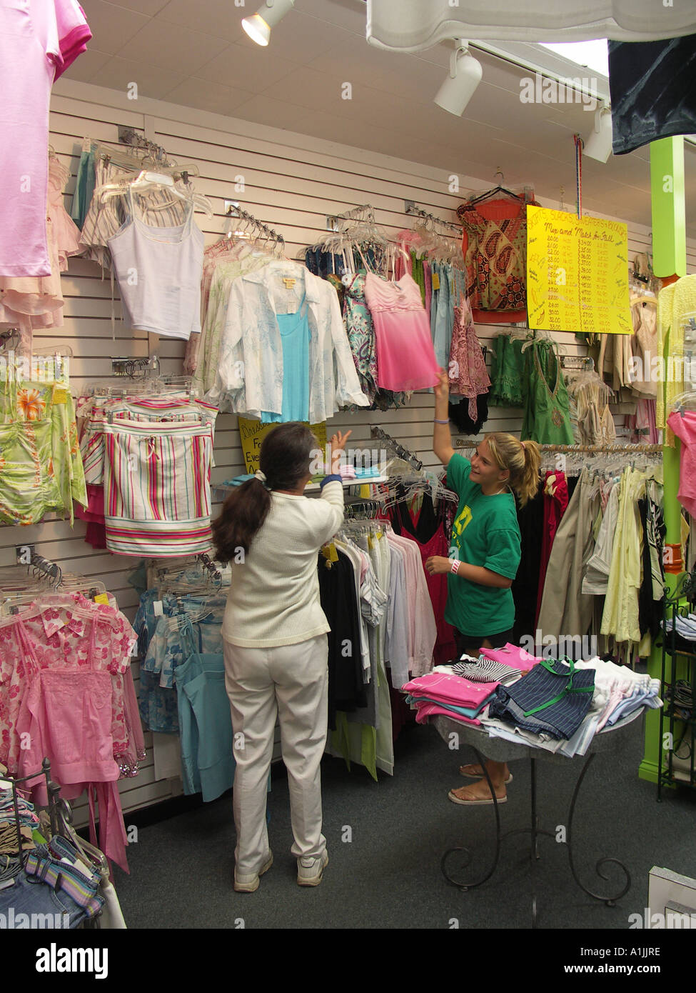 Comparing clothes store hi-res stock photography and images - Alamy