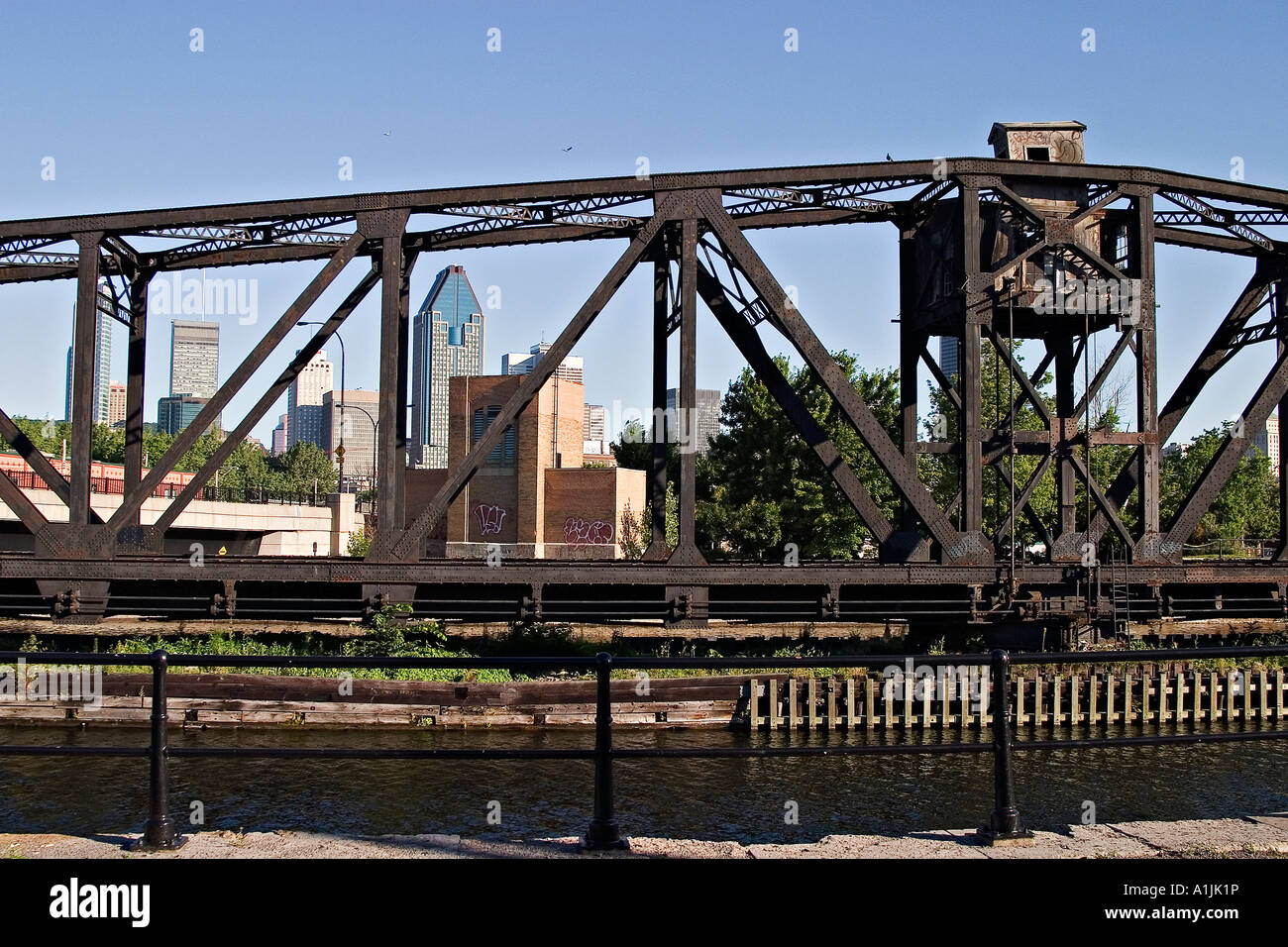 Downtown Montreal trough an old bridge structure Stock Photo - Alamy