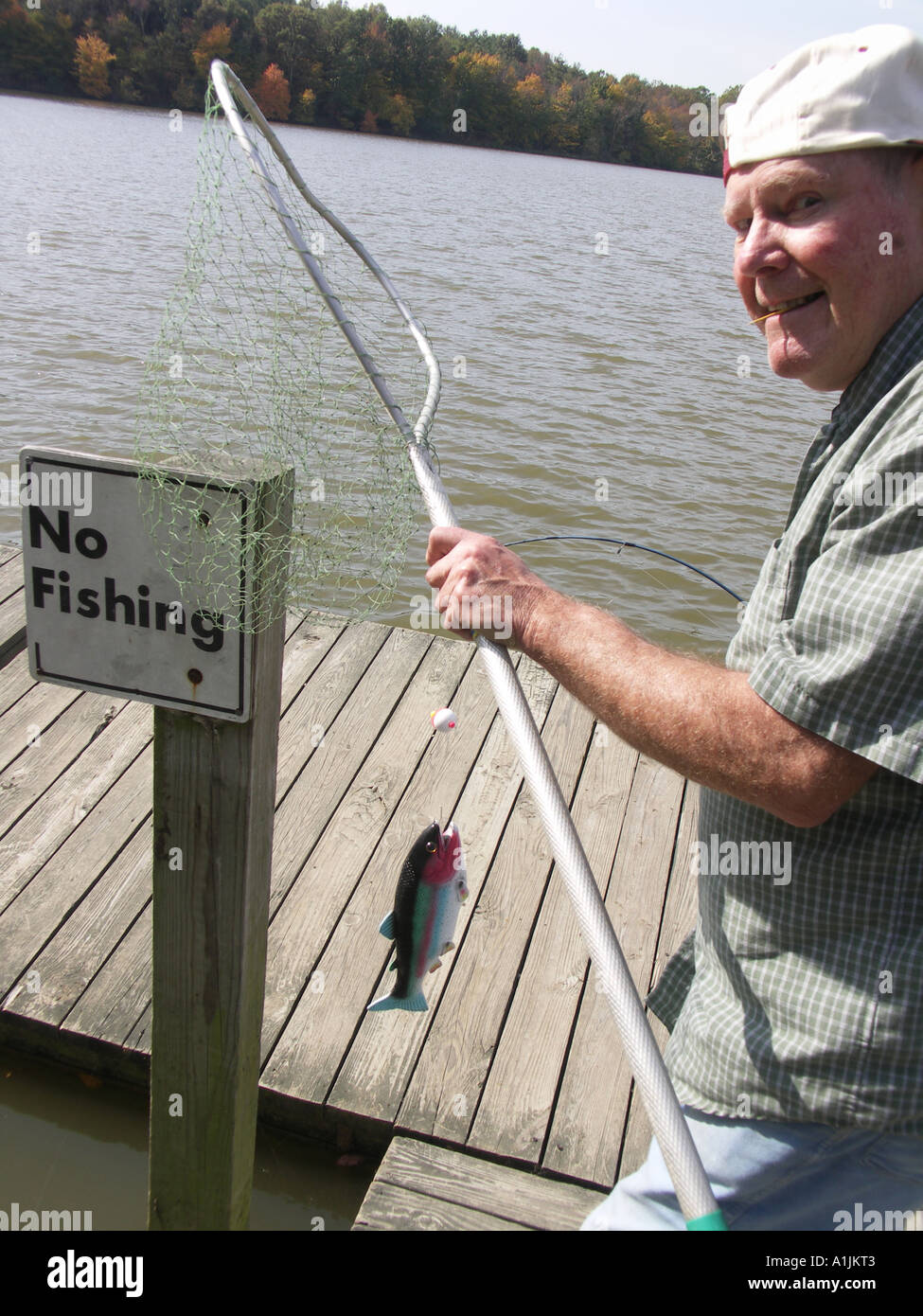 No Fishing Sign and Fake Fish Stock Photo - Alamy
