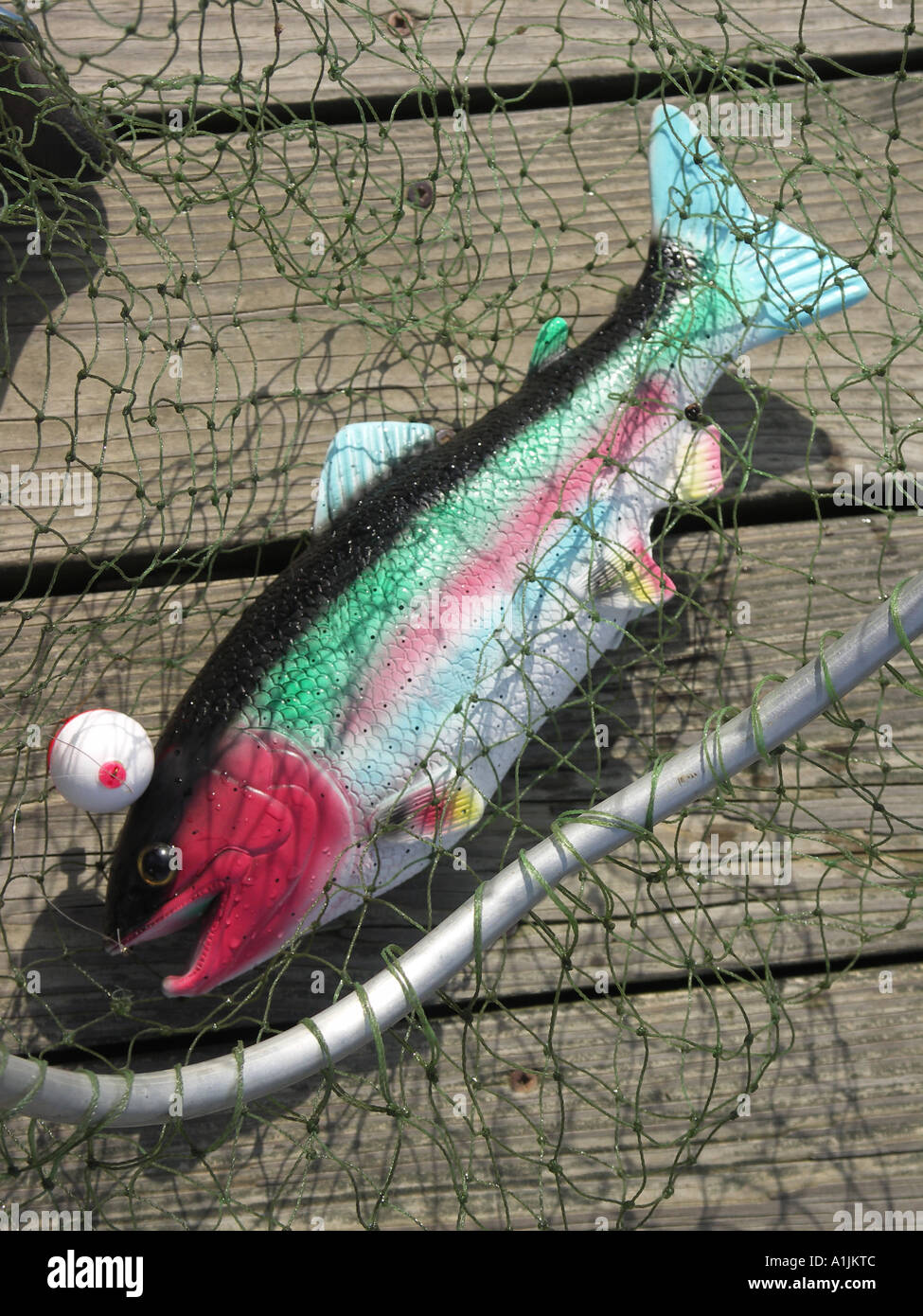 Fake Fish in Net Stock Photo - Alamy