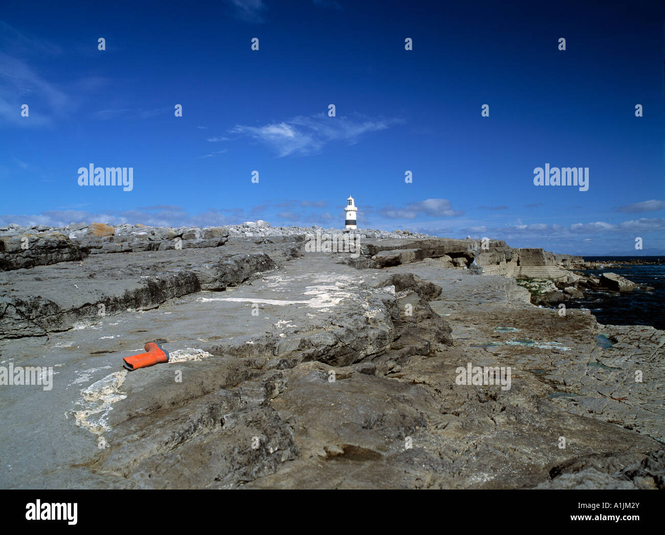 irish offshore atlantic coastal island of rock with colored wellington ...