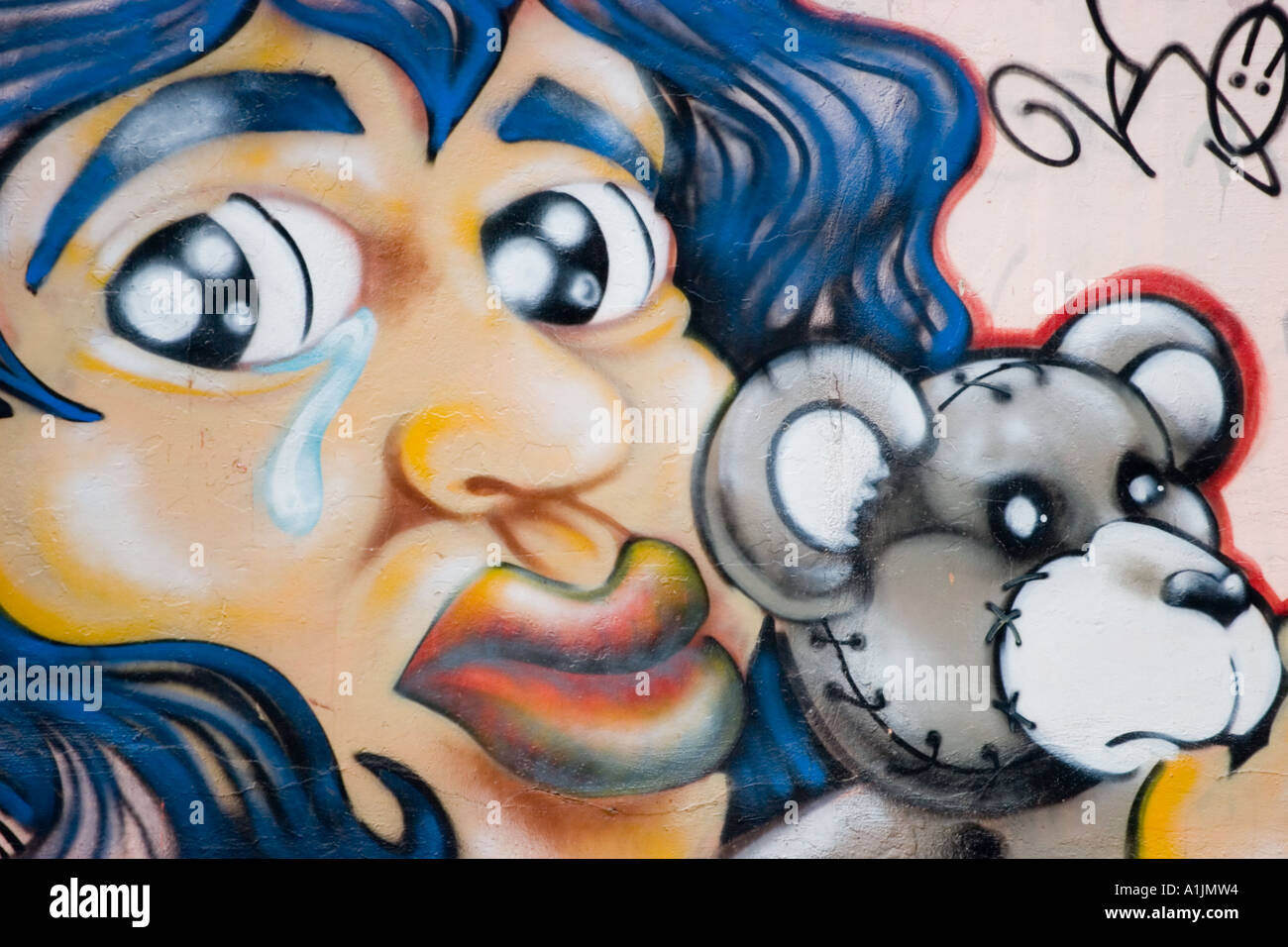 Rio Graffiti A - Crying girl and teddy Stock Photo - Alamy