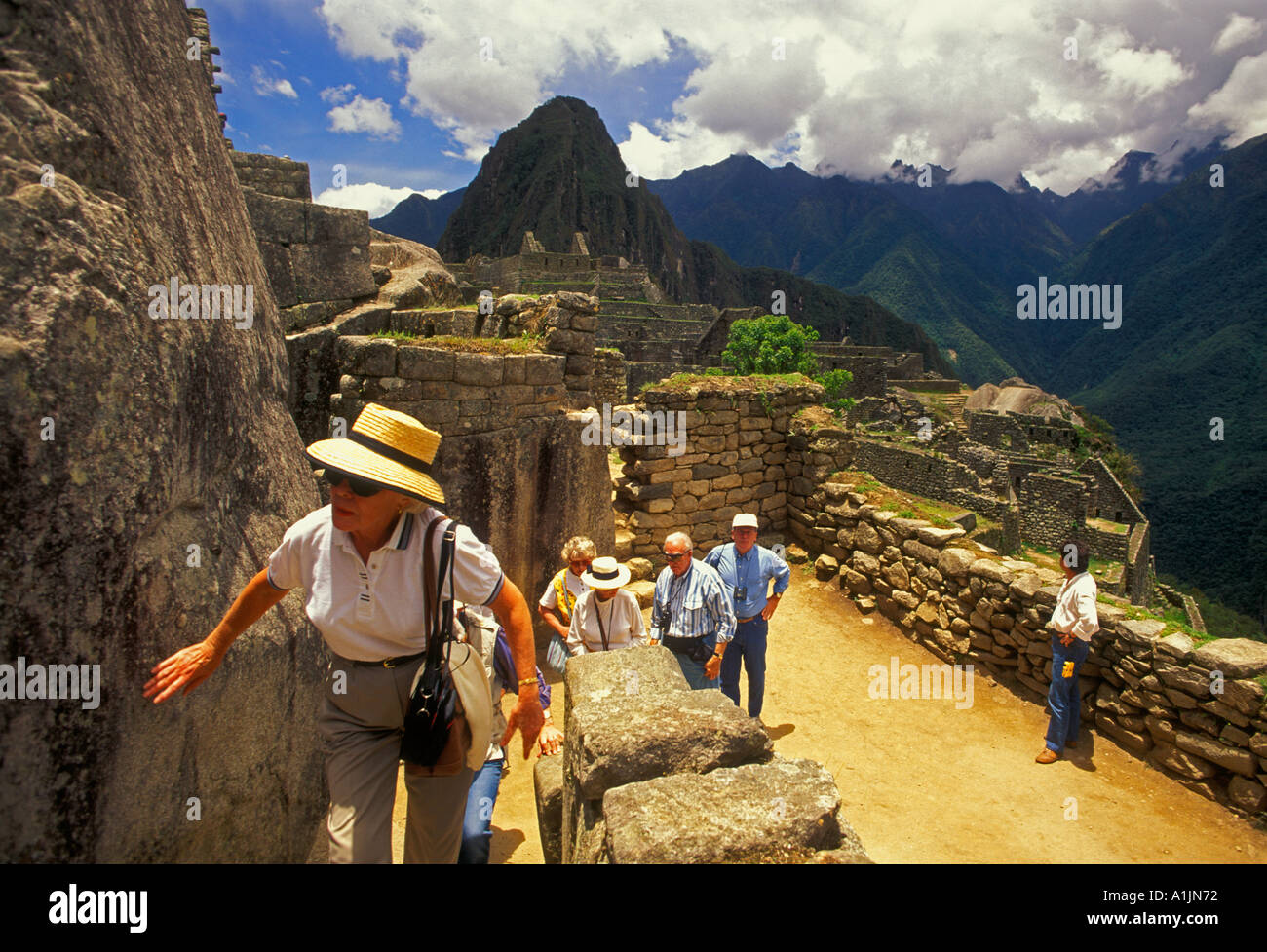 people tourists visiting Machu Picchu aka The Lost City of the Incas an ...