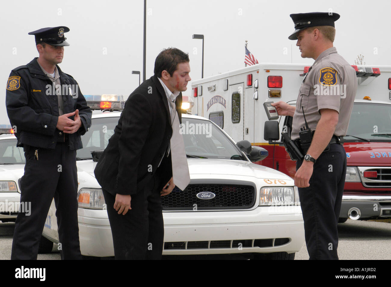 Prom Drunk Driving Demo Police officer administers breathalizer to ...