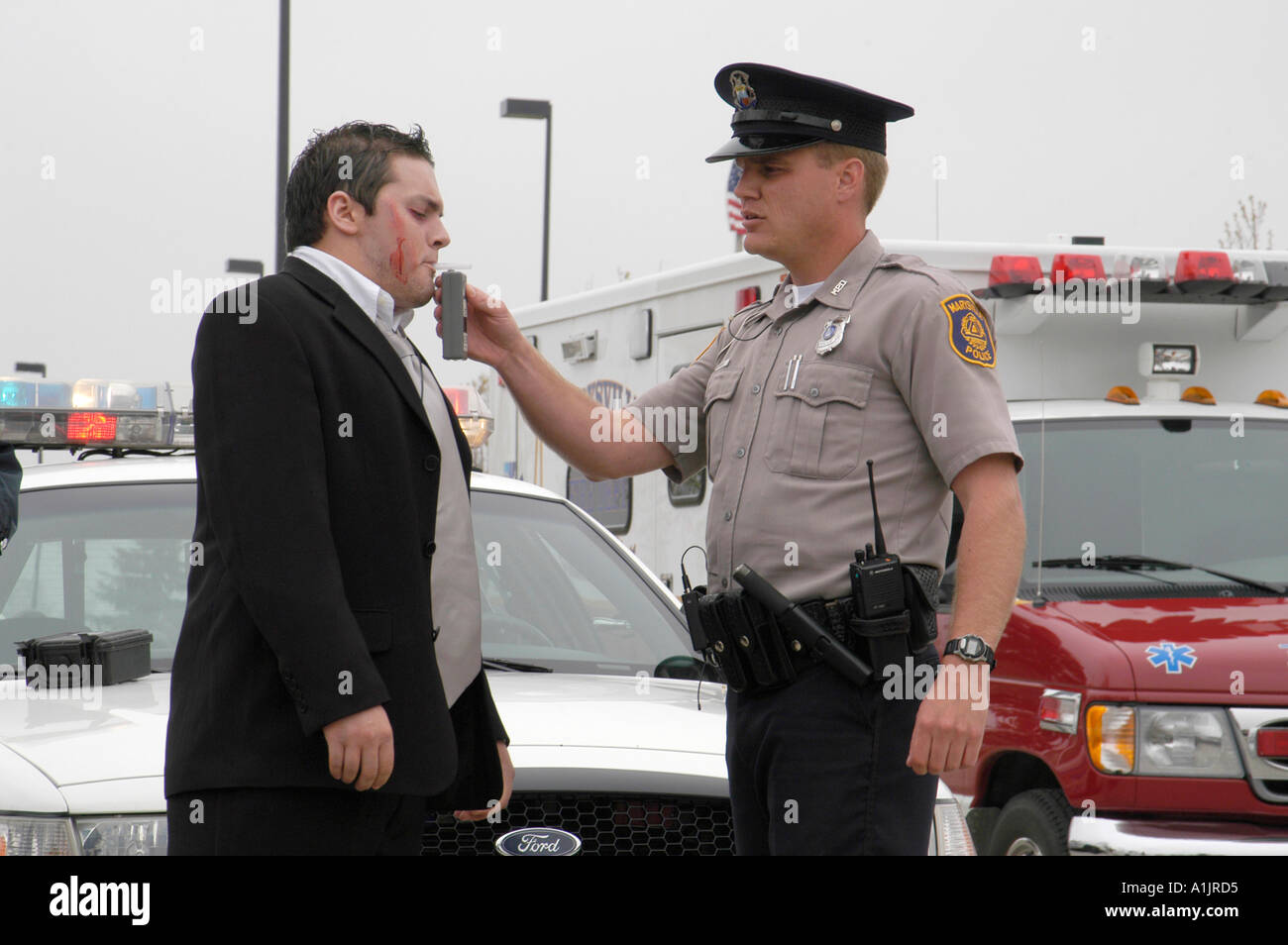 Prom Drunk Driving Demo Police officer administers breathalizer to ...