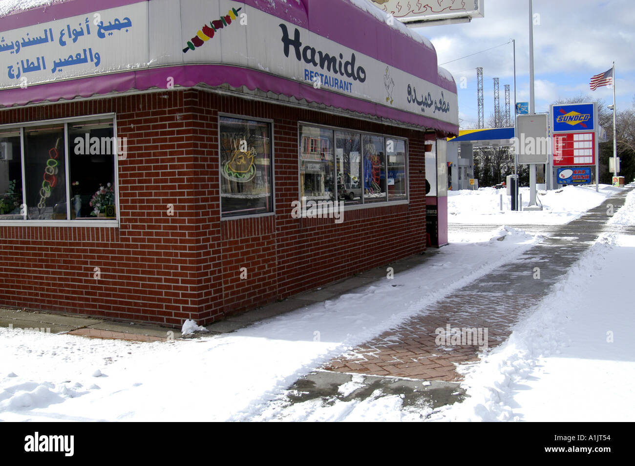 American Flag flies in background Hamido restaraunt with sign in Arabic ...