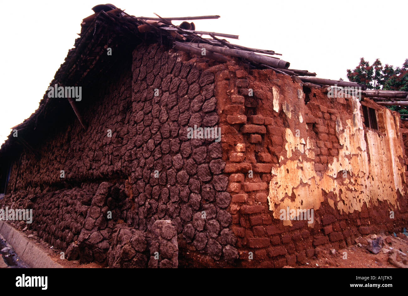 Home made of mud bricks coated with cow dung in a rural village Tamil ...