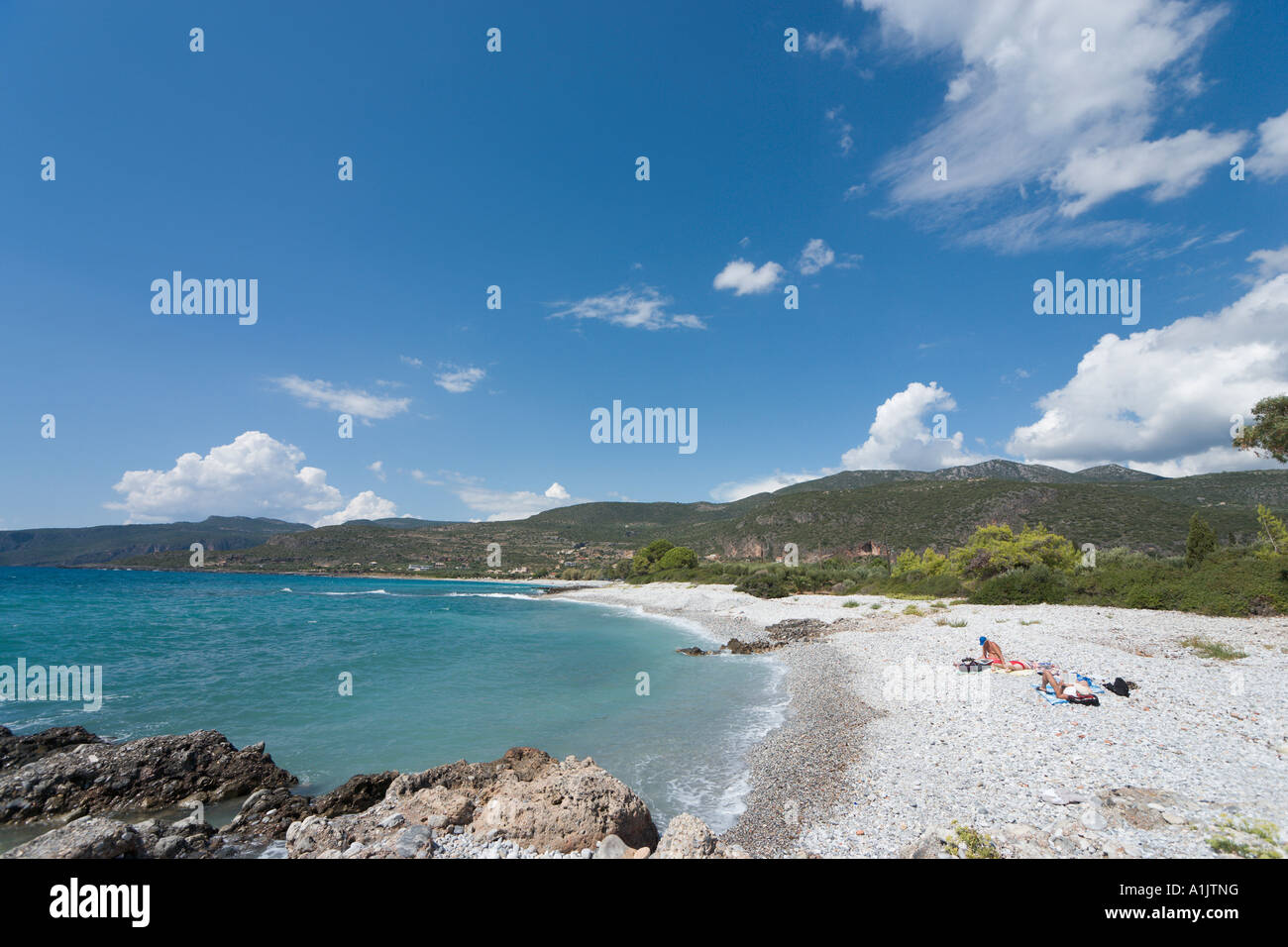 Couple on the main beach in Kardamyli, The Mani peninsula, Peloponnese ...