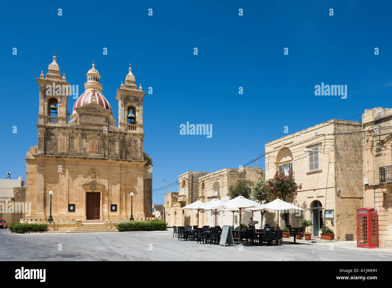 Church and restaurant in the main square, San Lawrenz, Gozo, Malta ...