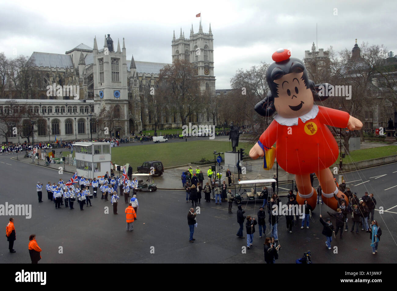 girl red dress inflatable puppet parliament street blow up huge giant ...