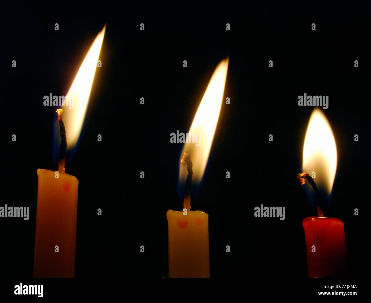 Closeup lit candle bright flame hi-res stock photography and images - Alamy