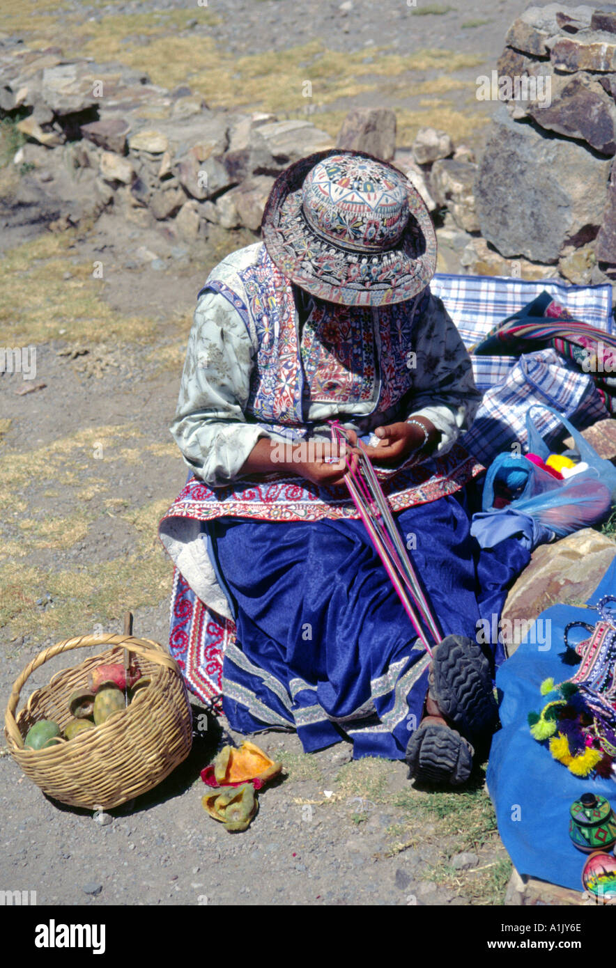 Woman making the traditional embroidered clothing and textiles of the ...