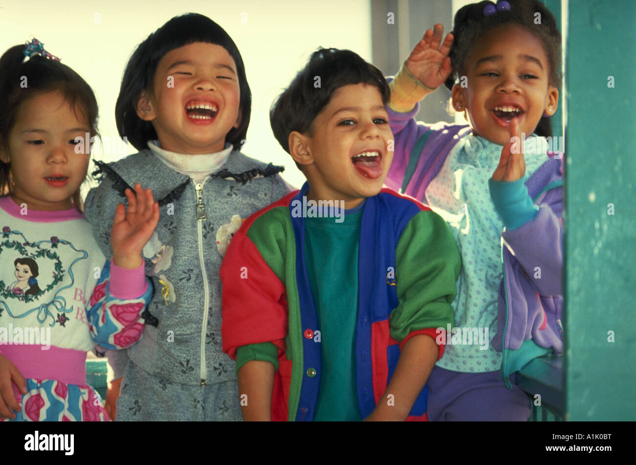 Four very happy and animated multicultural preschool children Stock ...