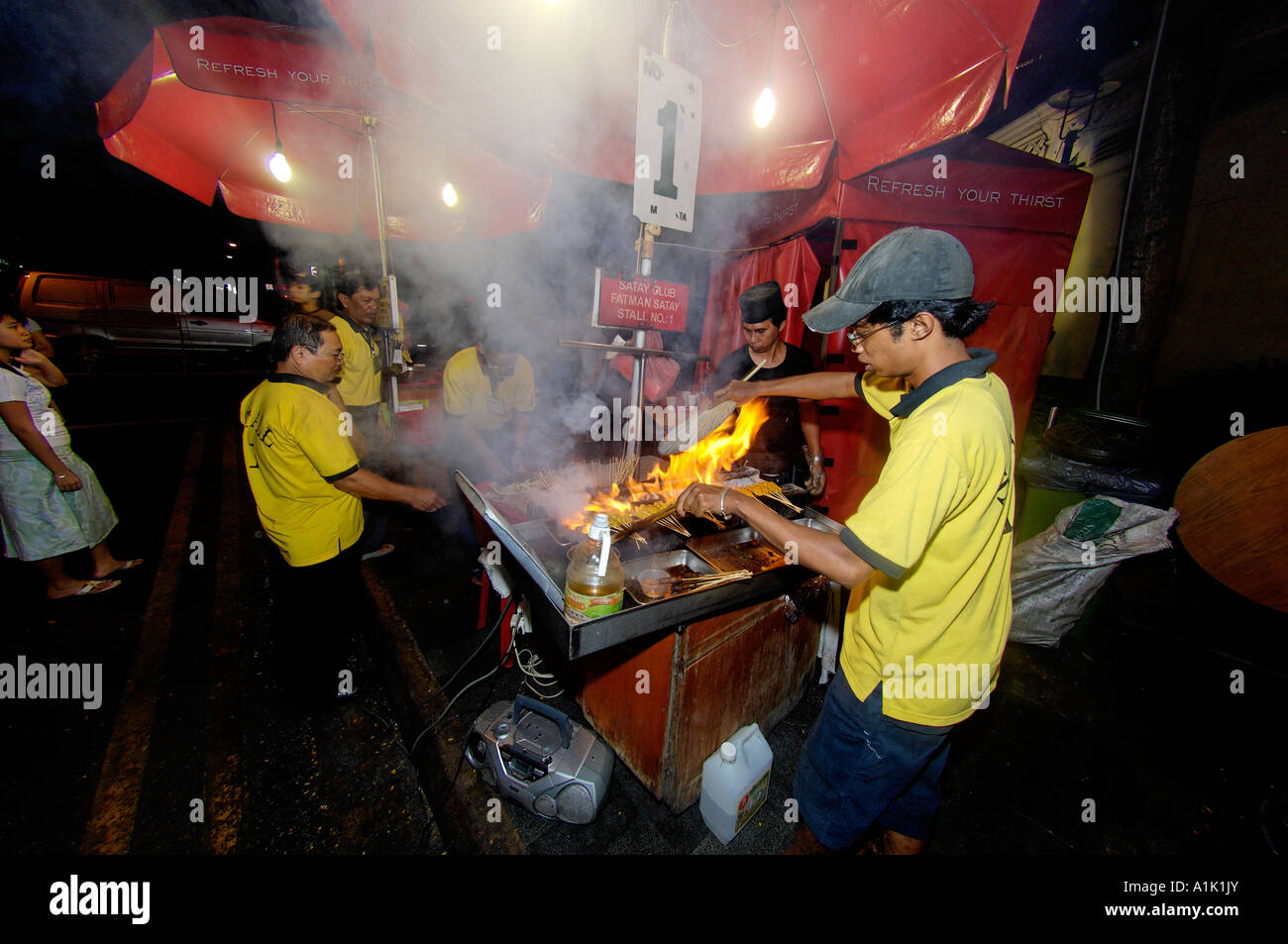 Satay being prepared at Stall Number 1, Lau Pa Sat in Singapore Stock ...