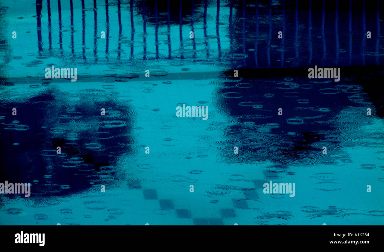 Reflections of rain in swimming pool Stock Photo - Alamy