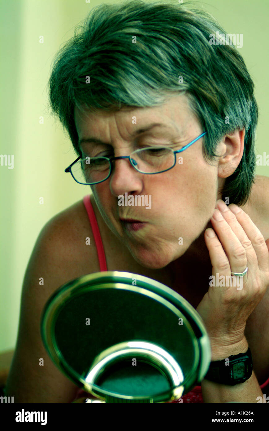 Preening woman hi-res stock photography and images - Alamy