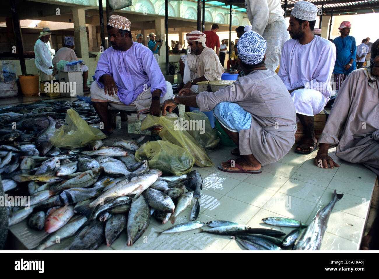 Fishermen display the daily catch at the Mutrah fish market in Muscat ...
