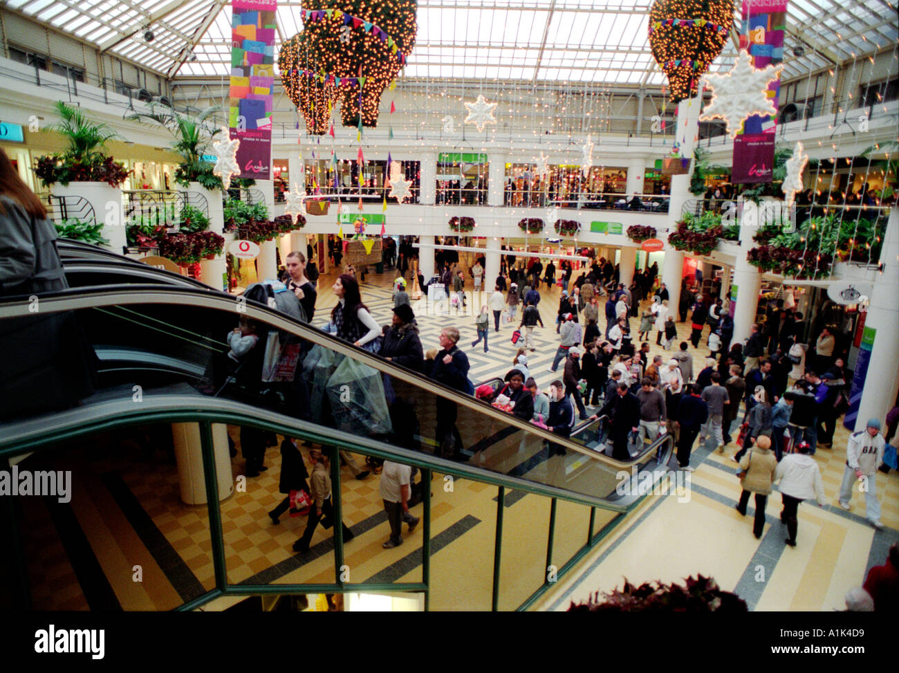 People at Christmas time in crowded shopping centre in London suburb ...