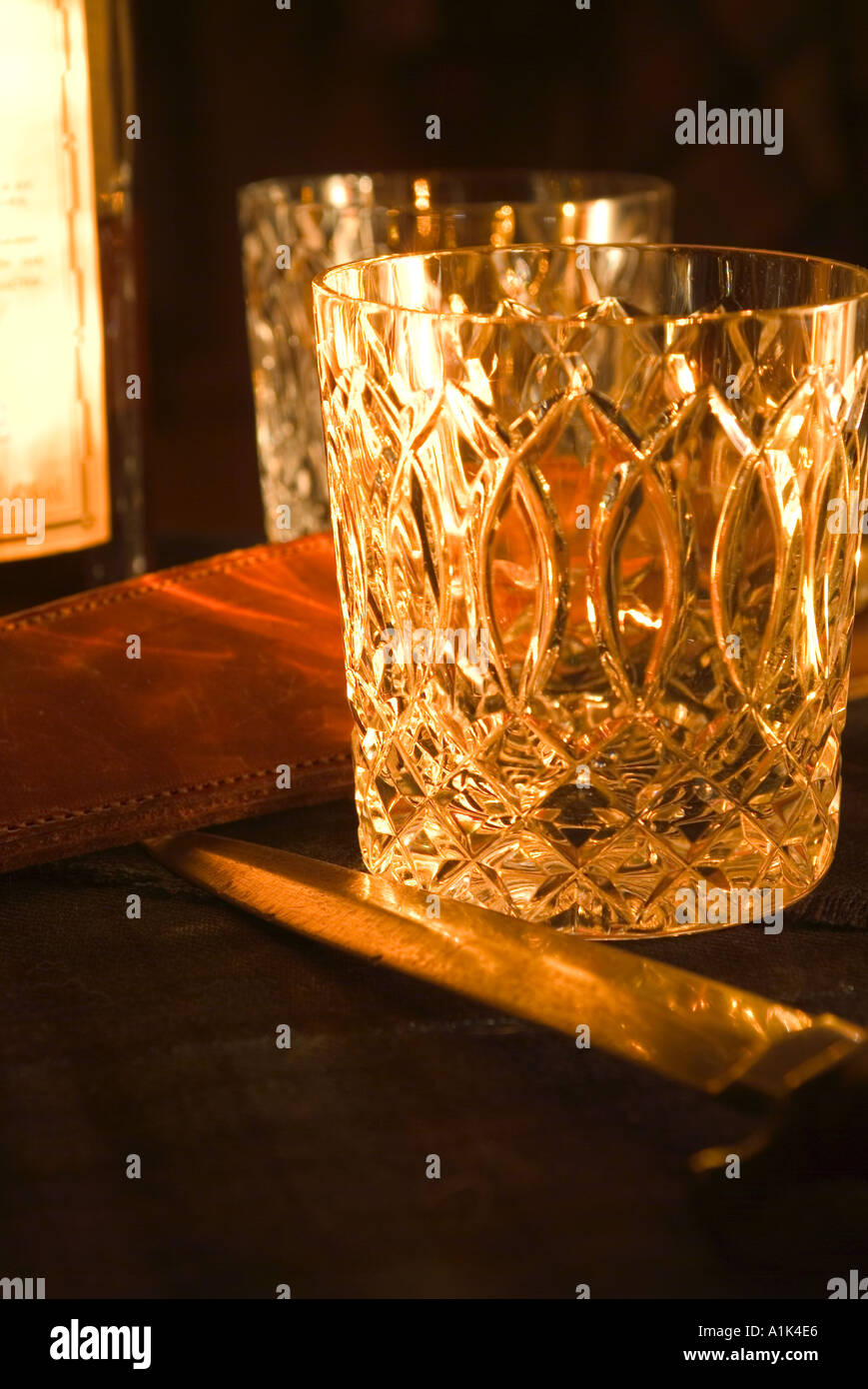 A warm and seductive composition of whiskey glass bottle and Scottish ...
