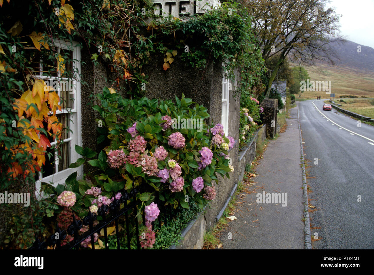 The entry of Pen and Gwryd Hotel hugs the road near Mount Snowdon ...
