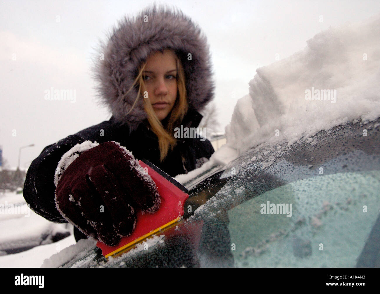 Clearing the windscreen Stock Photo - Alamy