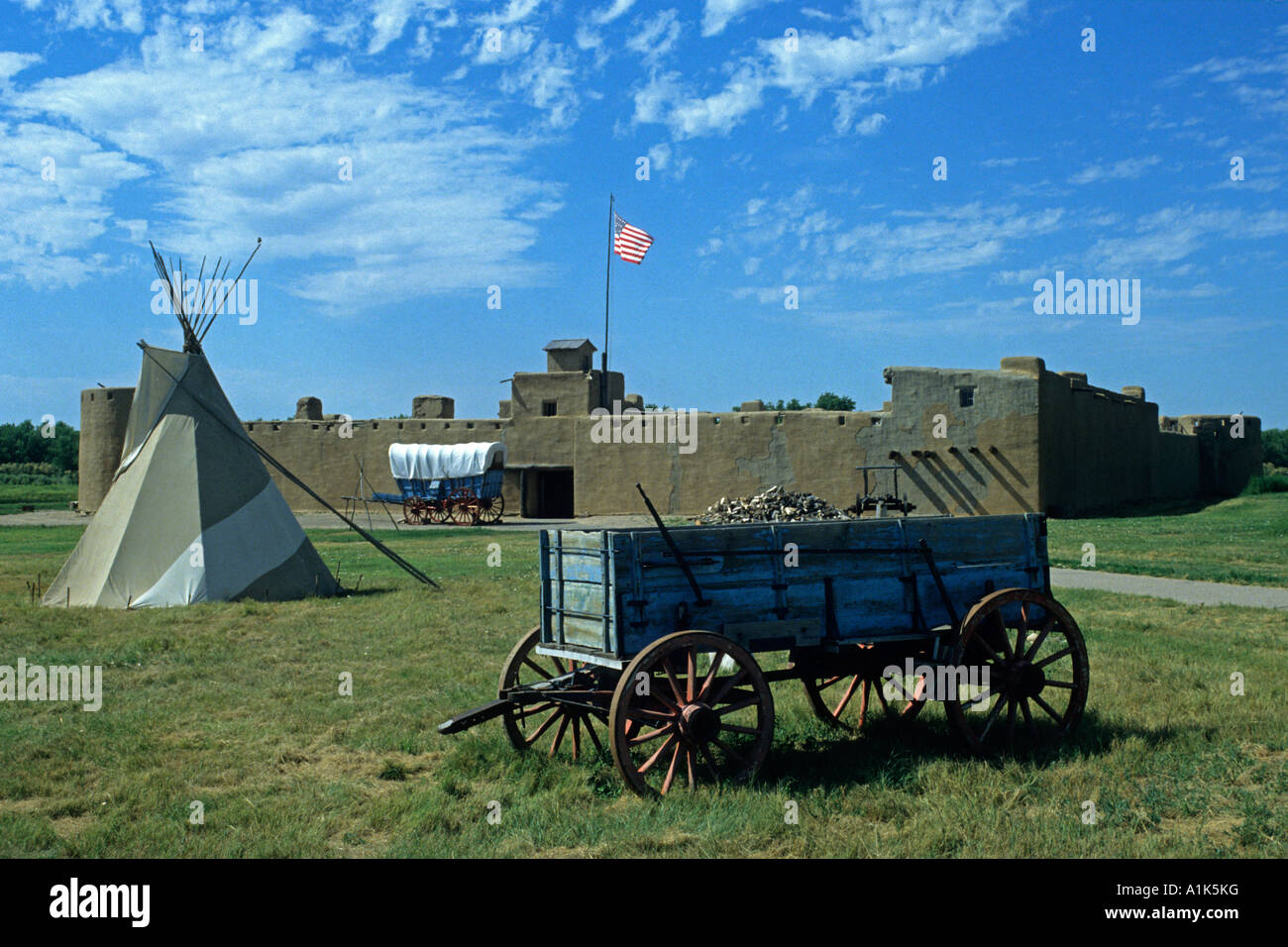 A teepee and wagon mark the entrance to Bent's Old Fort National ...