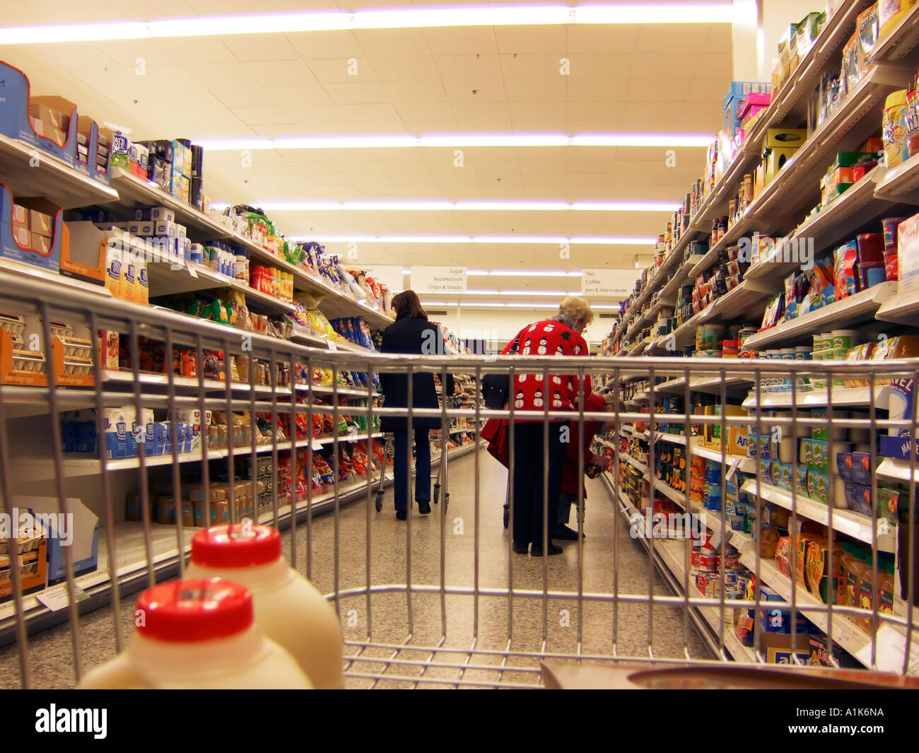 shopping in a supermarket goods in shopping trolley Stock Photo - Alamy