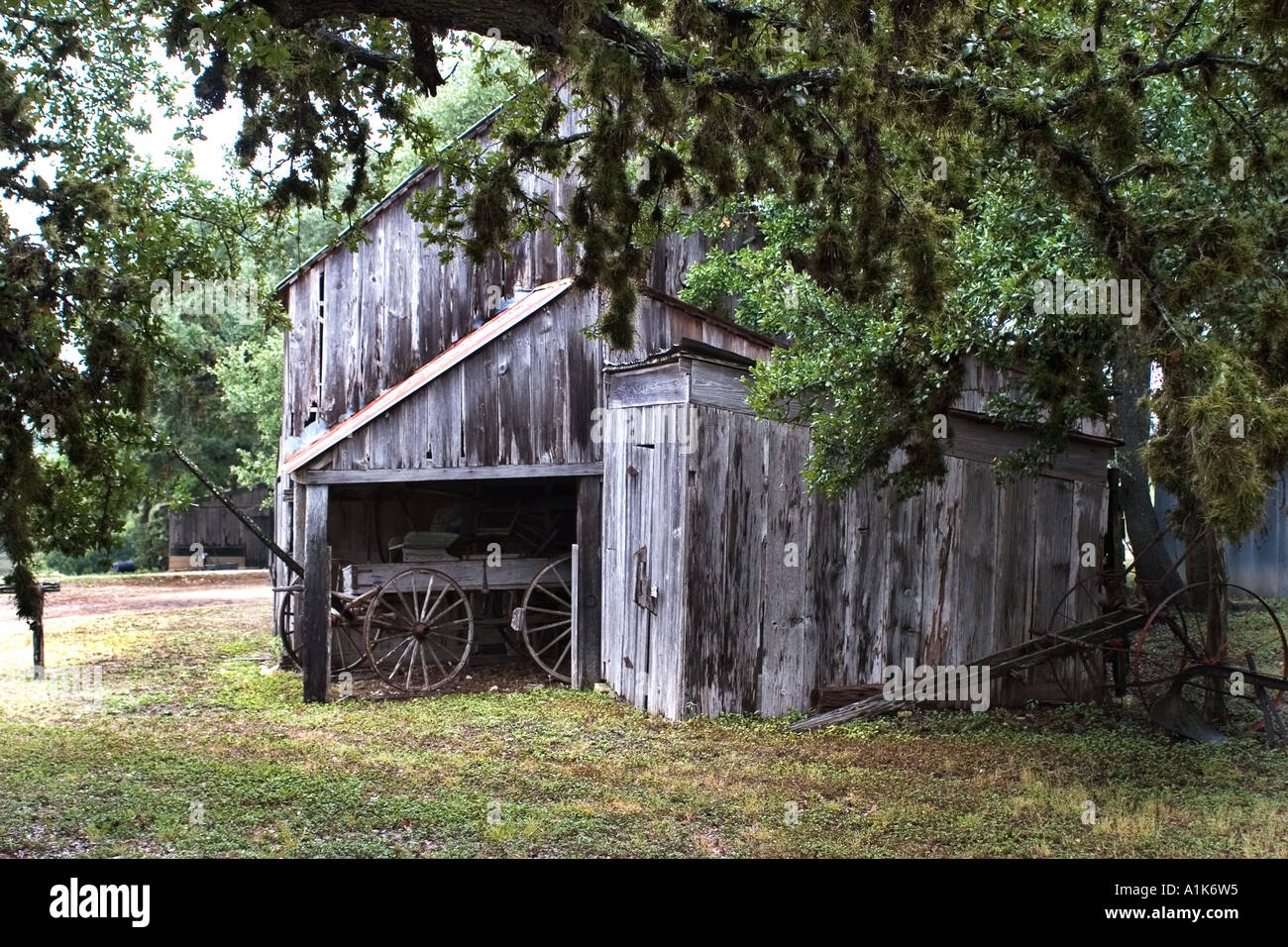 Barn with old wagon inside Stock Photo - Alamy