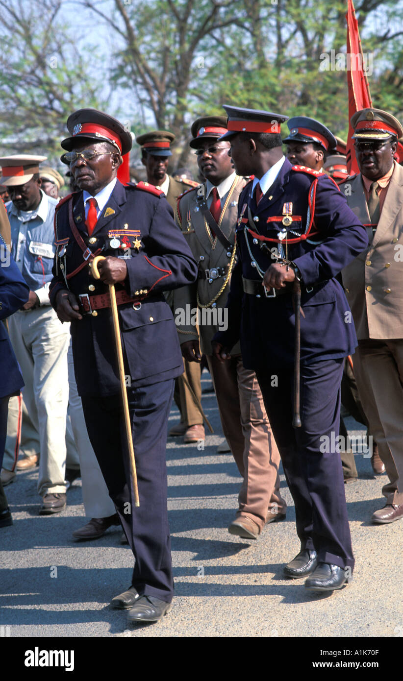 Tribal chiefs of paramilitary style group arriving at the town cemetery ...