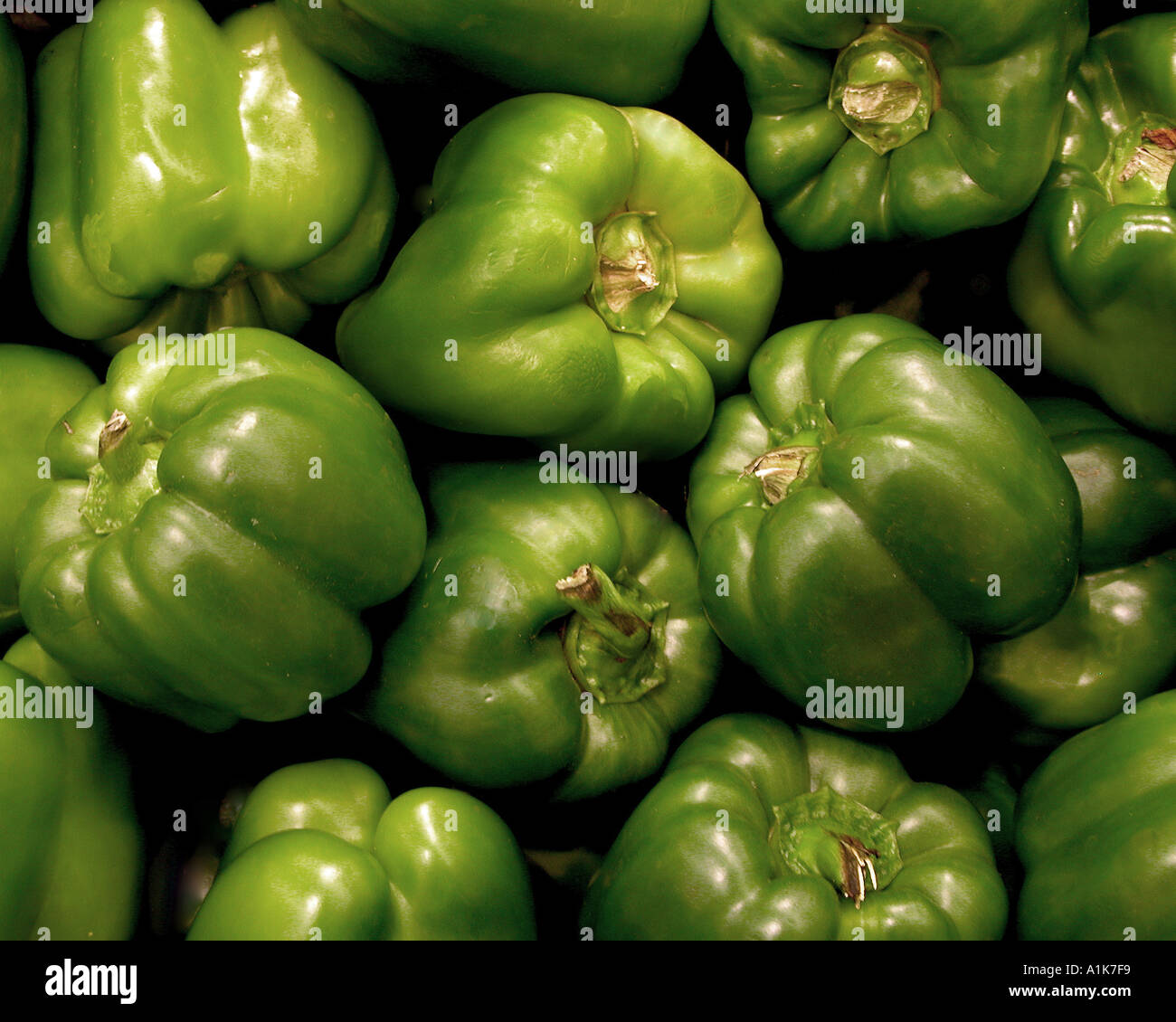 A pattern of green produce peppers on display Stock Photo - Alamy