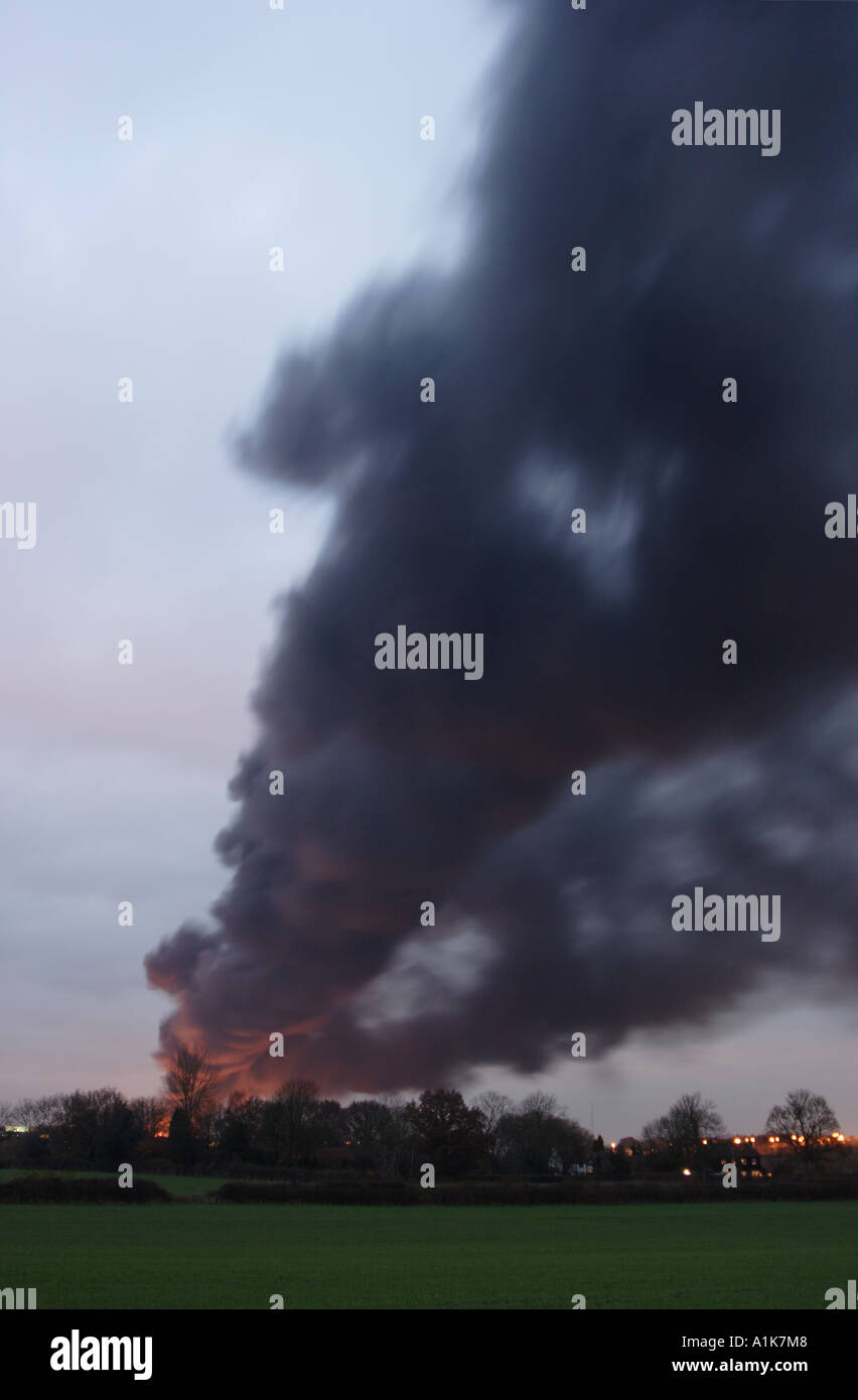 Flames and smoke billowing into the sky from the oil fire and explosion ...