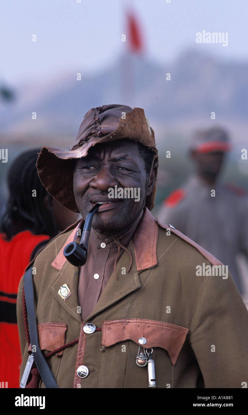 Tribal chief smoking a pipe poses for a photo The main Herero festival ...