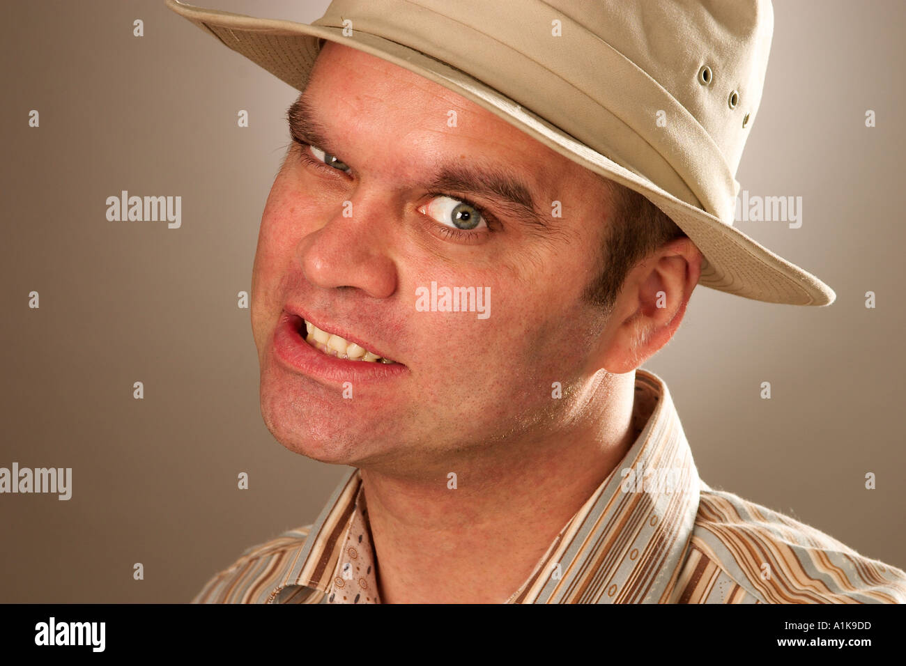MR Menacing guy with hat Stock Photo - Alamy