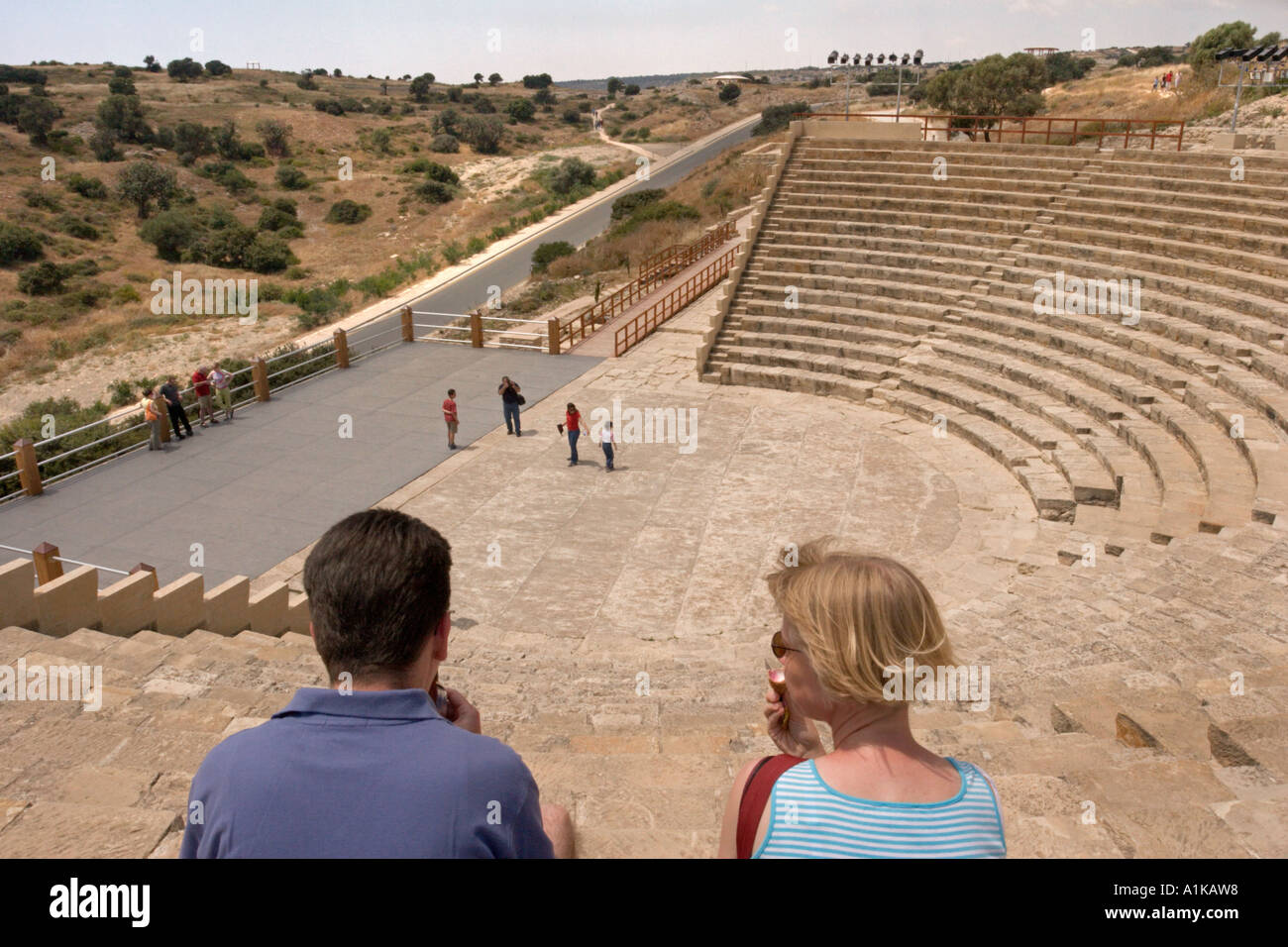 Cyprus Tourists sit at the top of the Theatre at Kourion Stock Photo ...