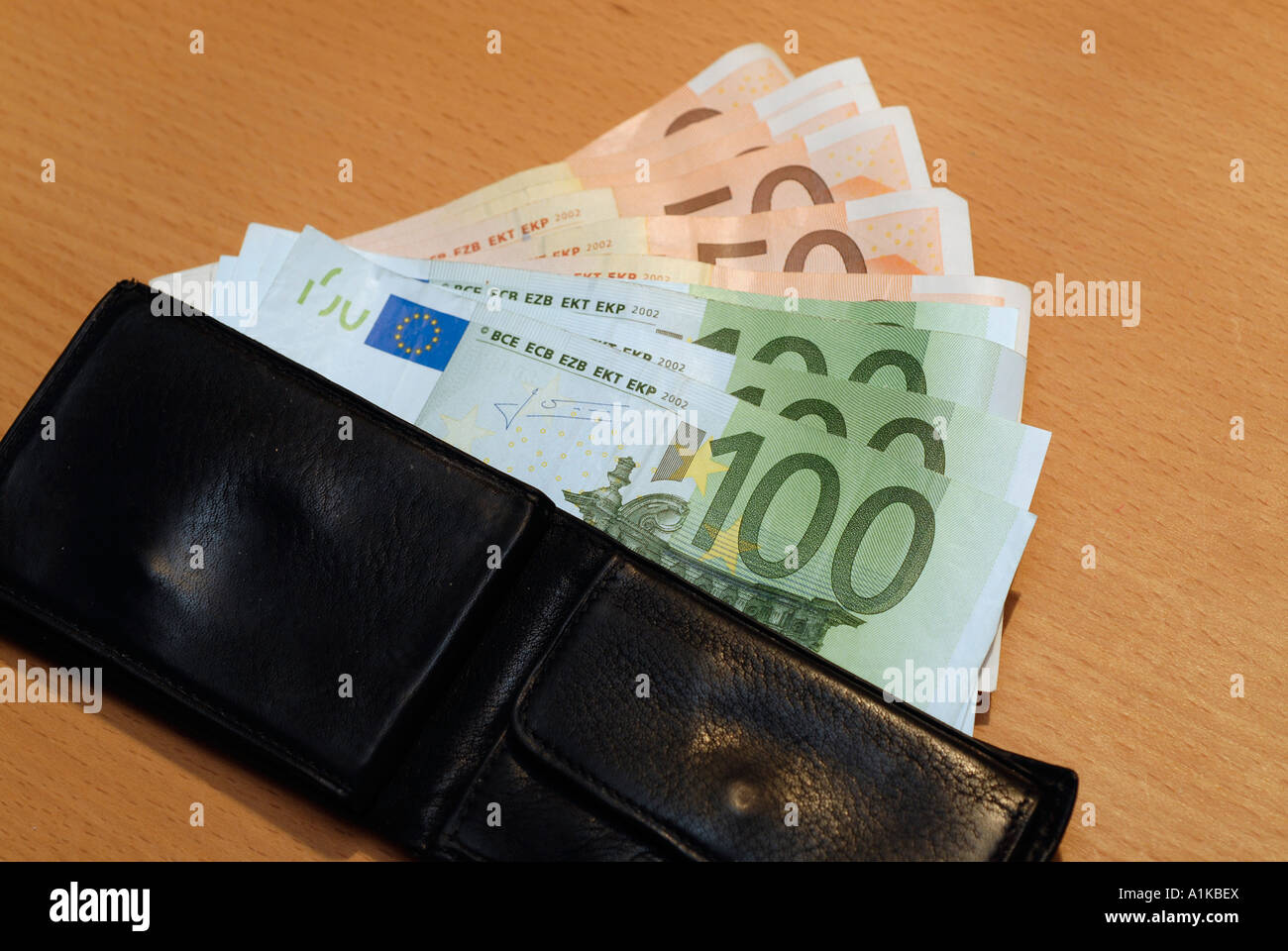 Purse with euro banknotes Stock Photo - Alamy