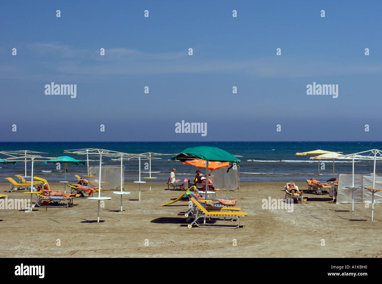 Larnaca beach Cyprus, looking out to sea with sunbathers in front Stock ...