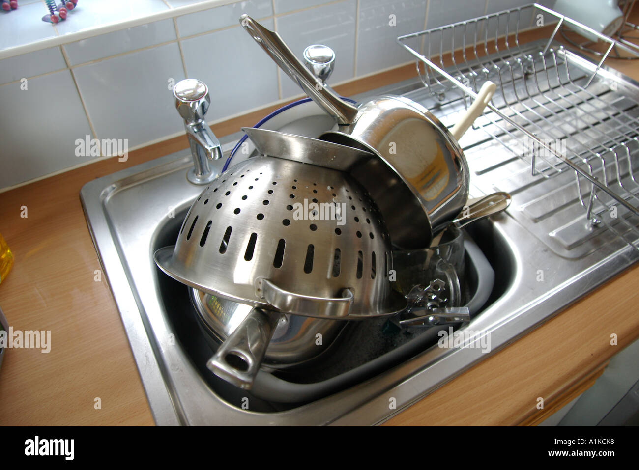 Kitchen sink dishes pots pans hi-res stock photography and images - Alamy