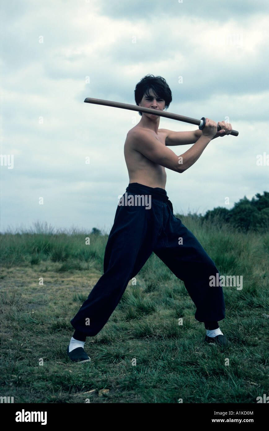 Young man practising martial arts Stock Photo - Alamy