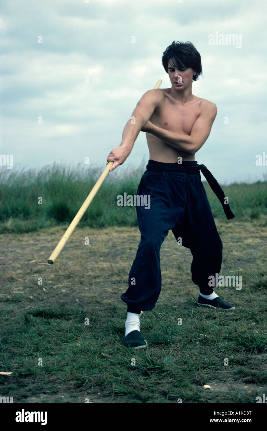 Young man practising martial arts Stock Photo - Alamy