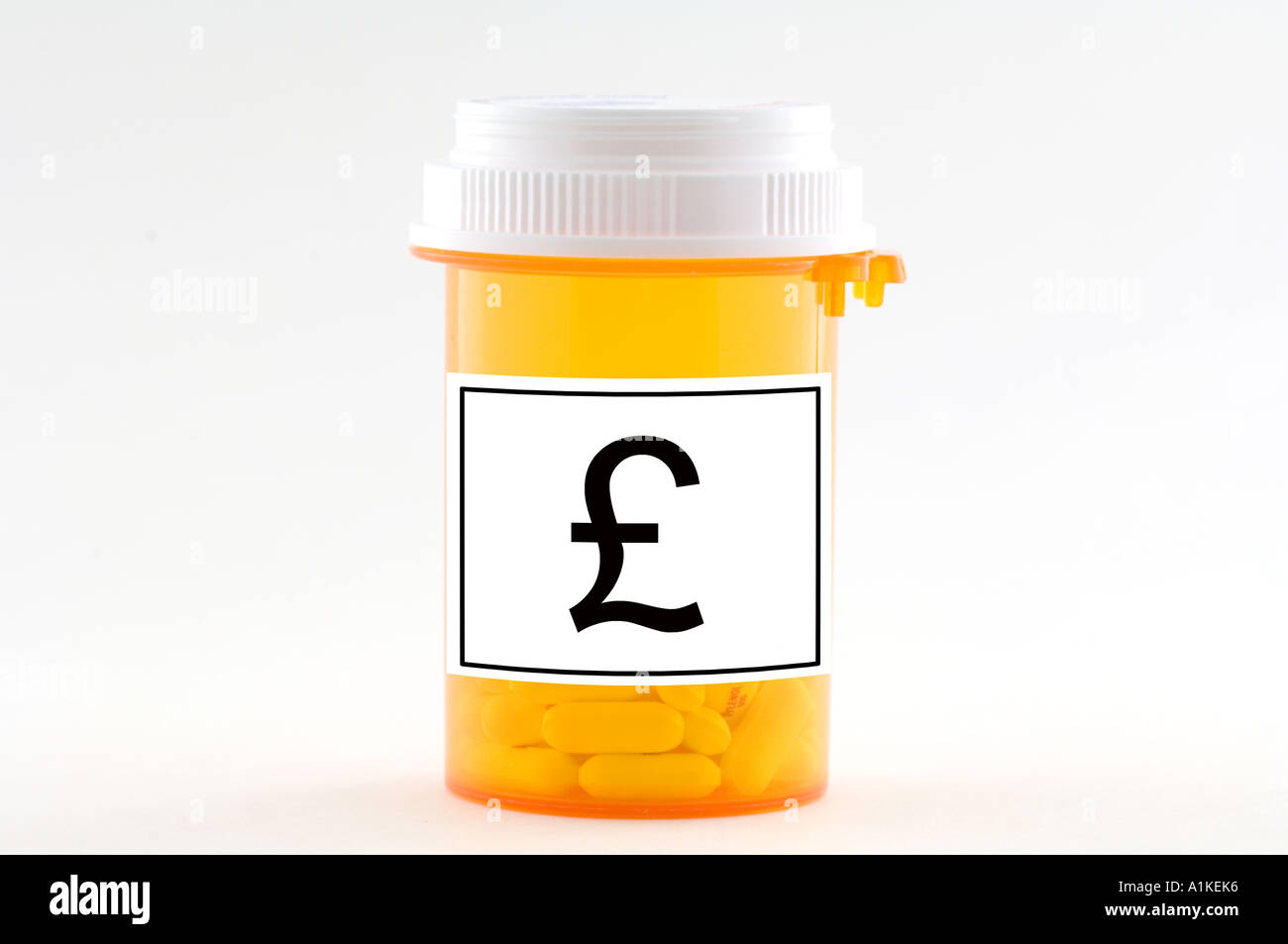 closeup view of pill bottle with British Pound label Stock Photo - Alamy