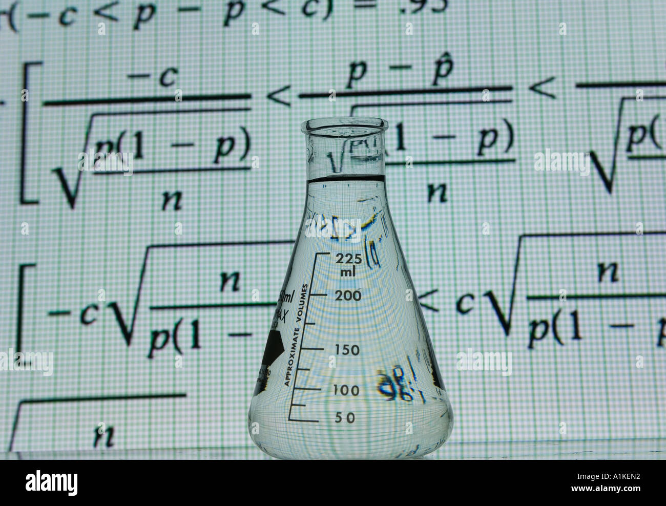 beaker of liquid and math symbols background Stock Photo - Alamy
