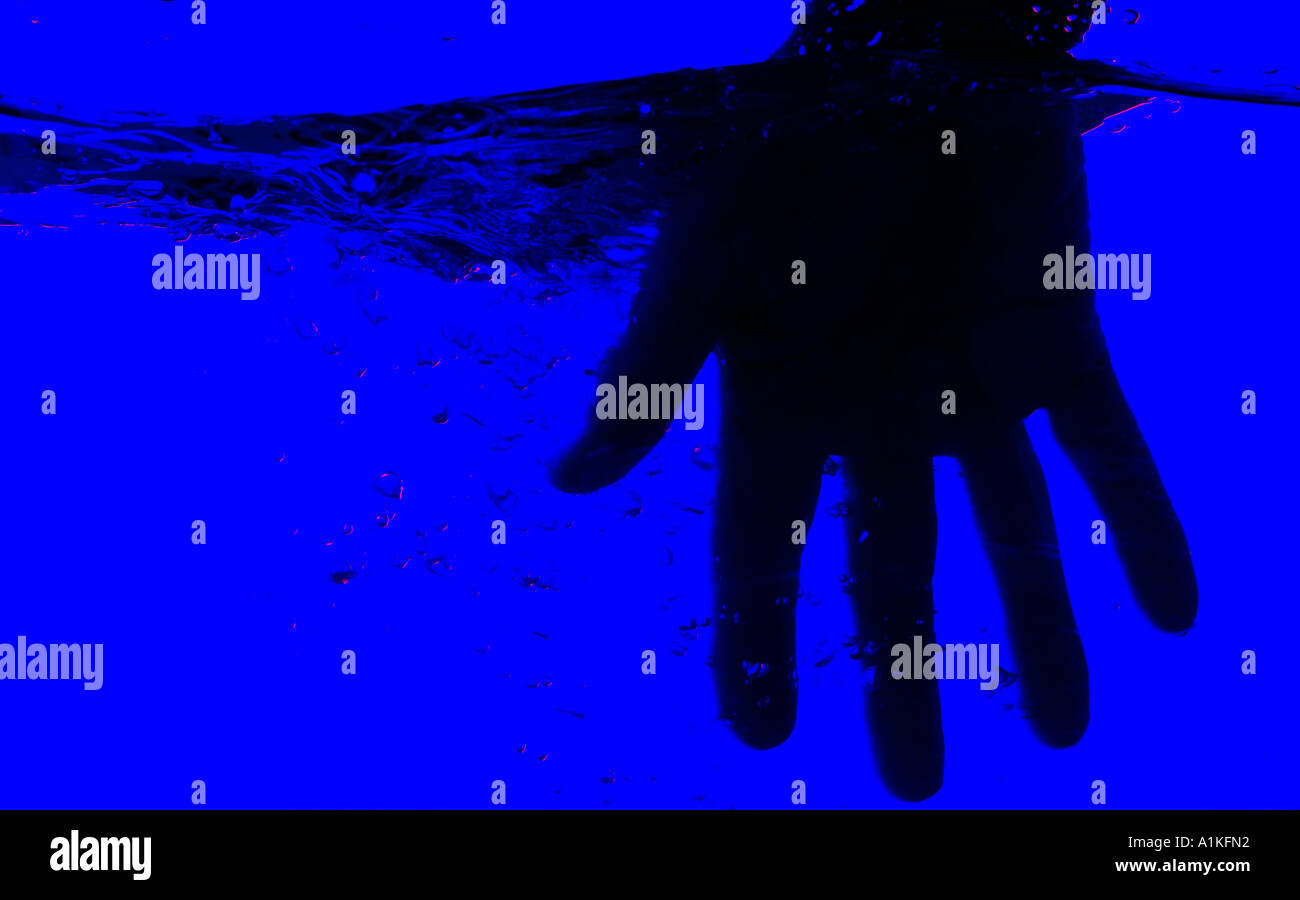 hand dipping into water making splash and bubbles Stock Photo - Alamy