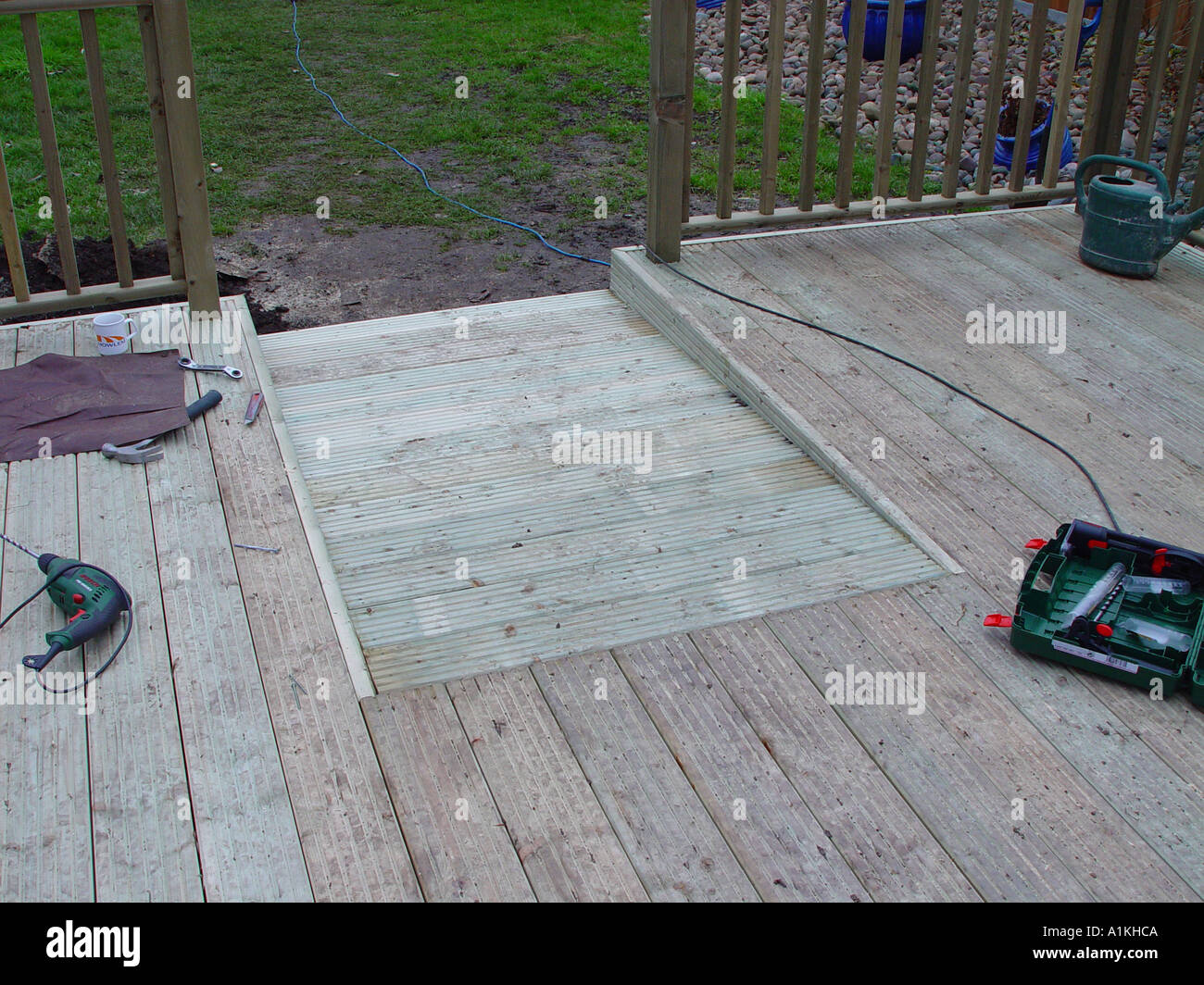 Deck deck construction with access ramp for wheelchair Stock Photo - Alamy