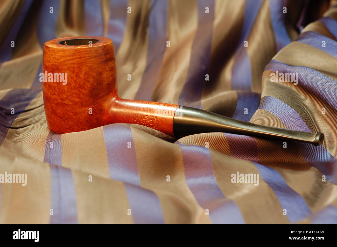 still life Old wooden pipe on fabric background Stock Photo - Alamy