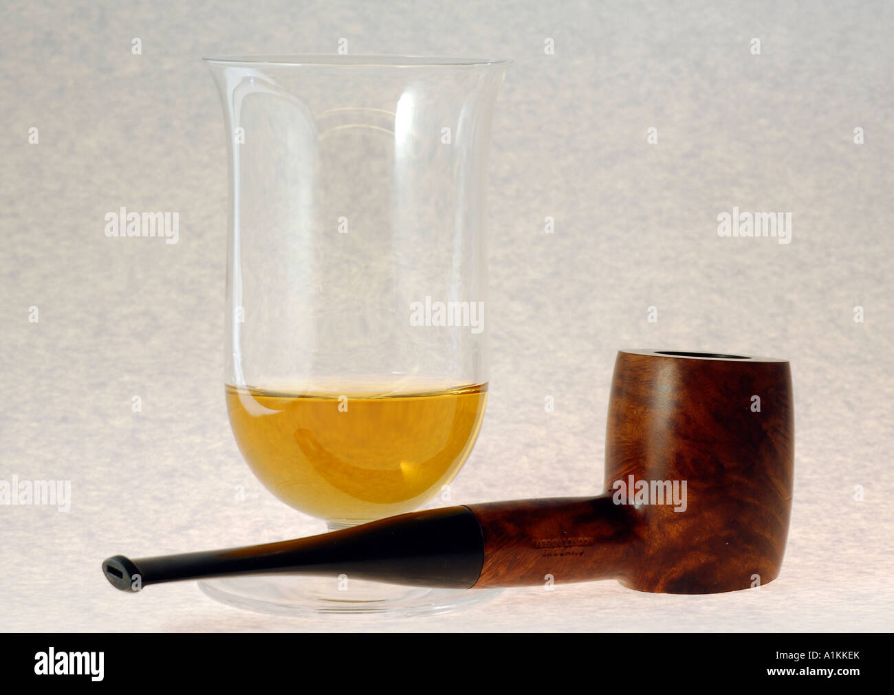 still life Old wooden pipe and a glass of single malt highlands scotch ...