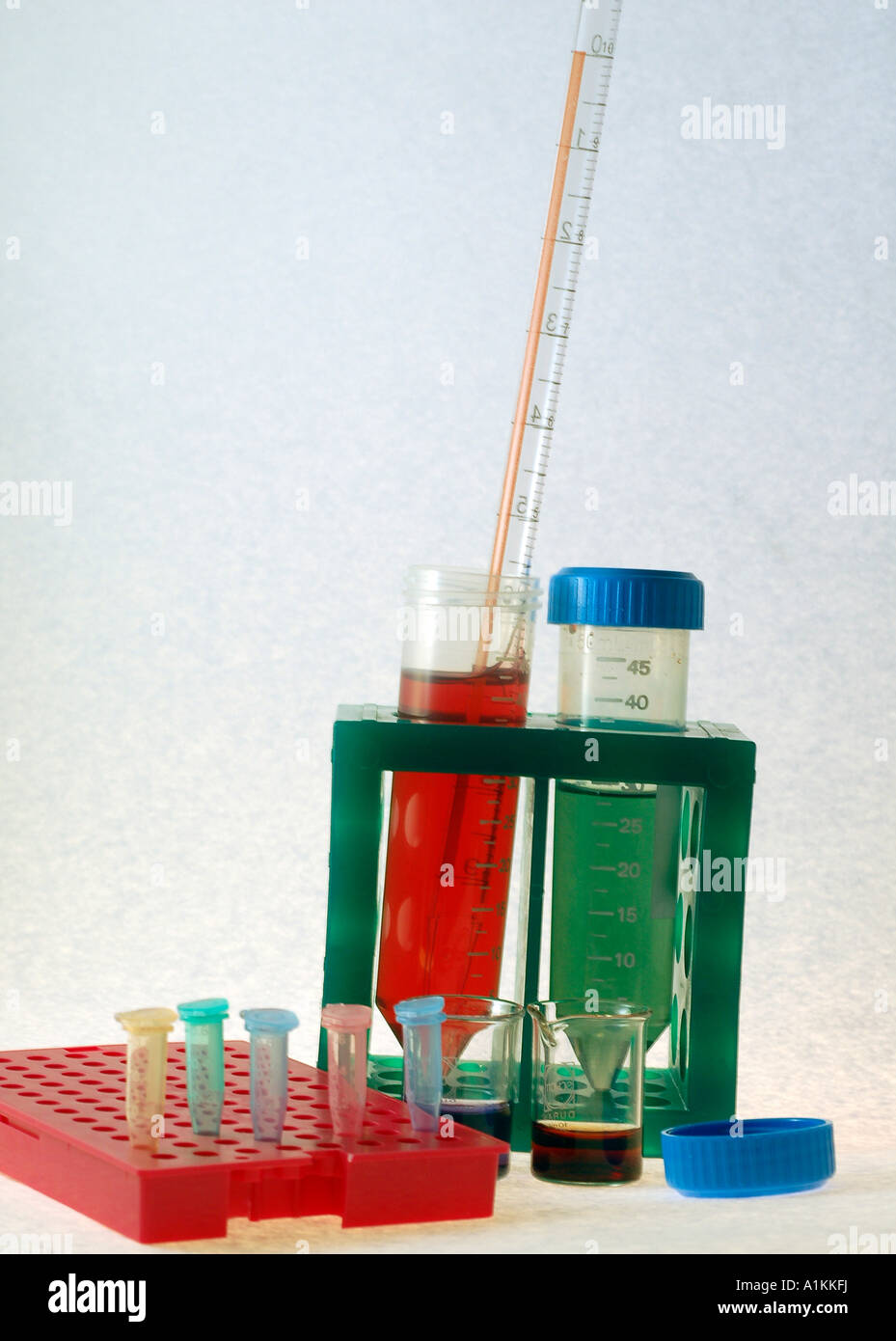 Adding chemicals to test tubes in a tube rack Stock Photo - Alamy