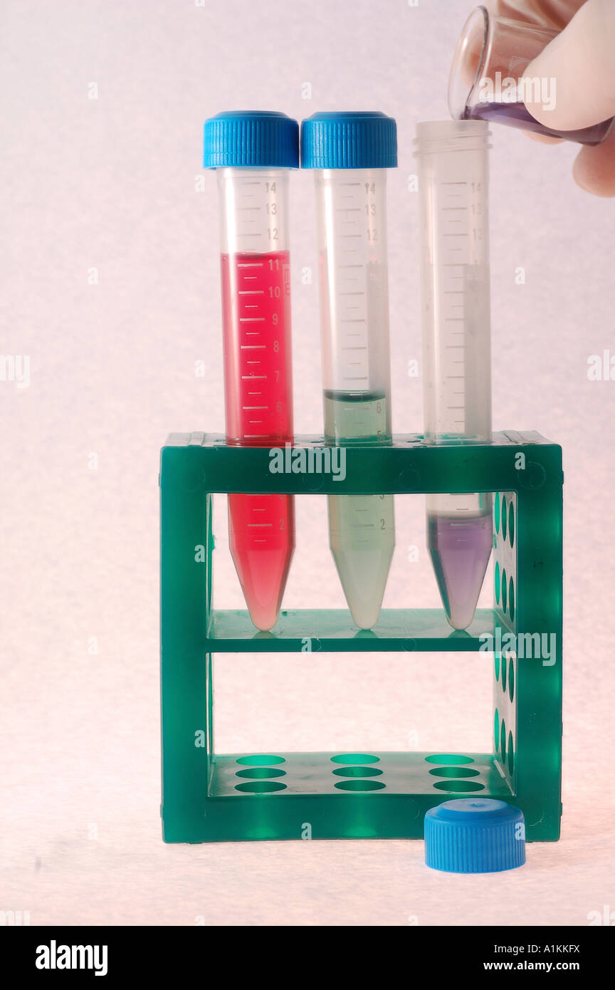 Hand with test tubes and reagents hi-res stock photography and images ...