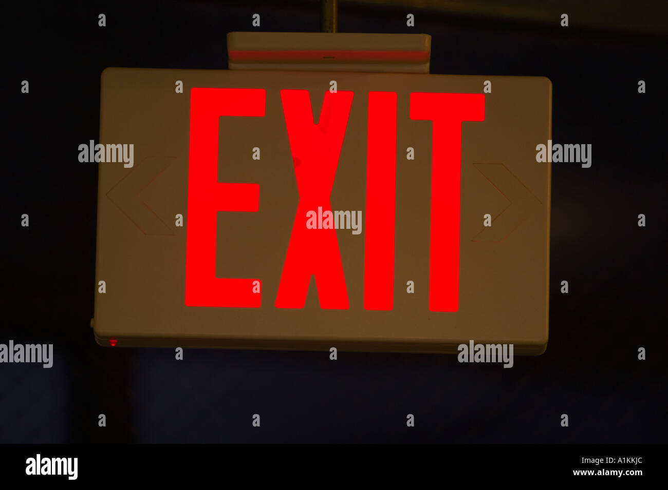 A glowing electric exit sign Stock Photo - Alamy